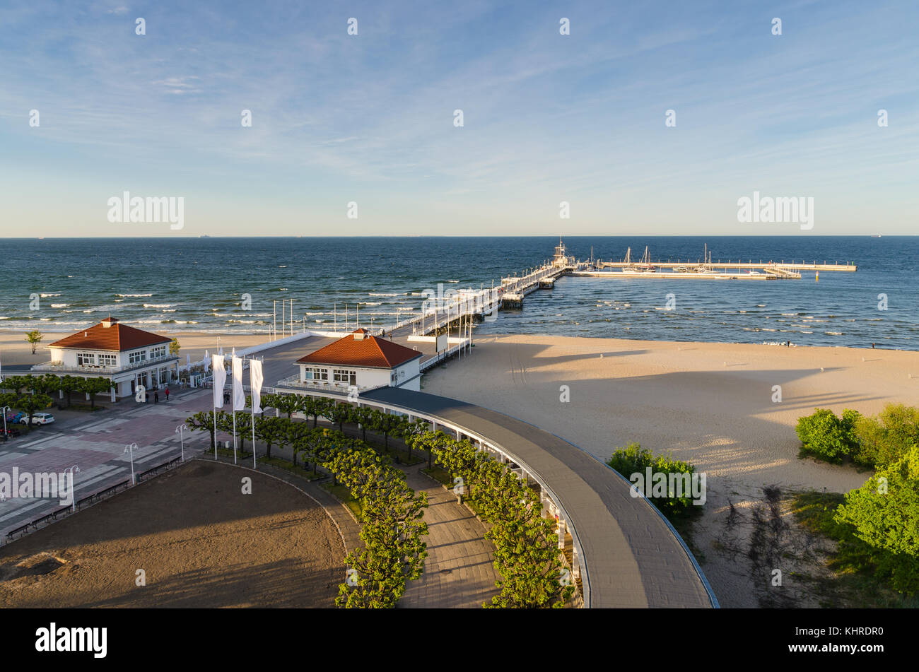 View of wooden pier and beautiful sandy beach in Sopot resort. Baltic ...
