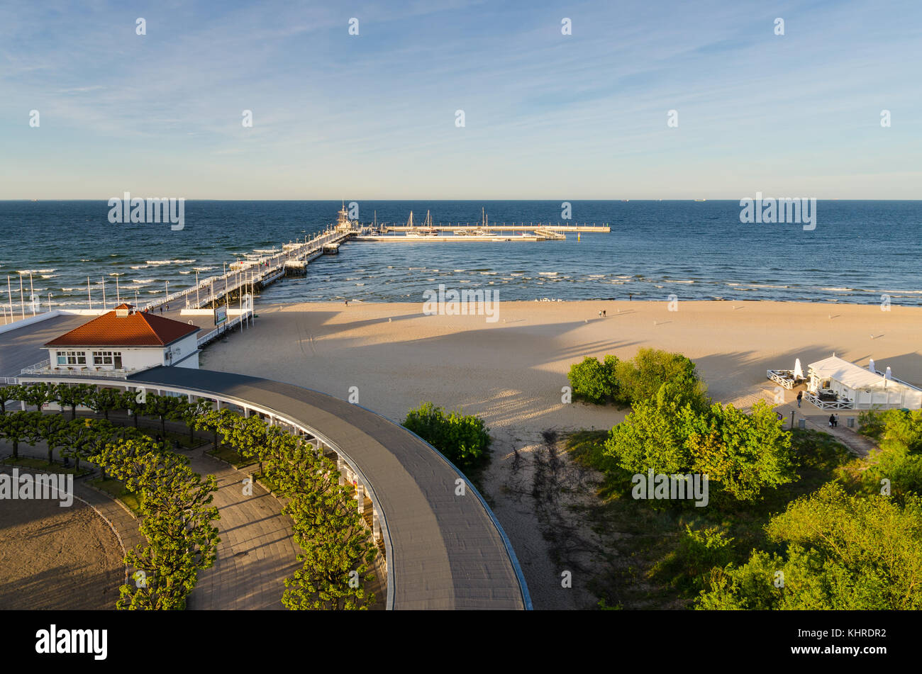 View of wooden pier and beautiful sandy beach in Sopot resort. Baltic ...