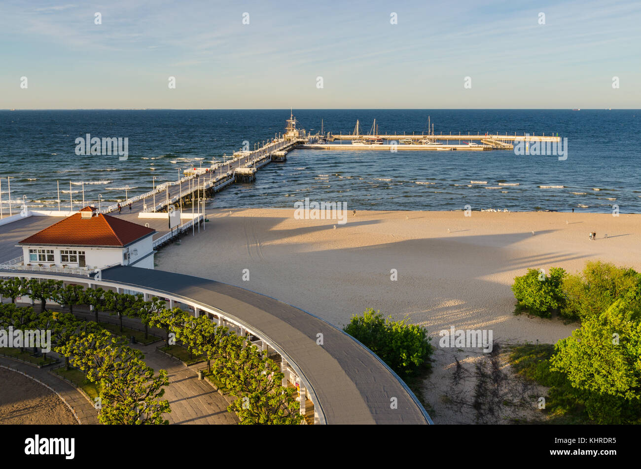View of wooden pier and beautiful sandy beach in Sopot resort. Baltic ...