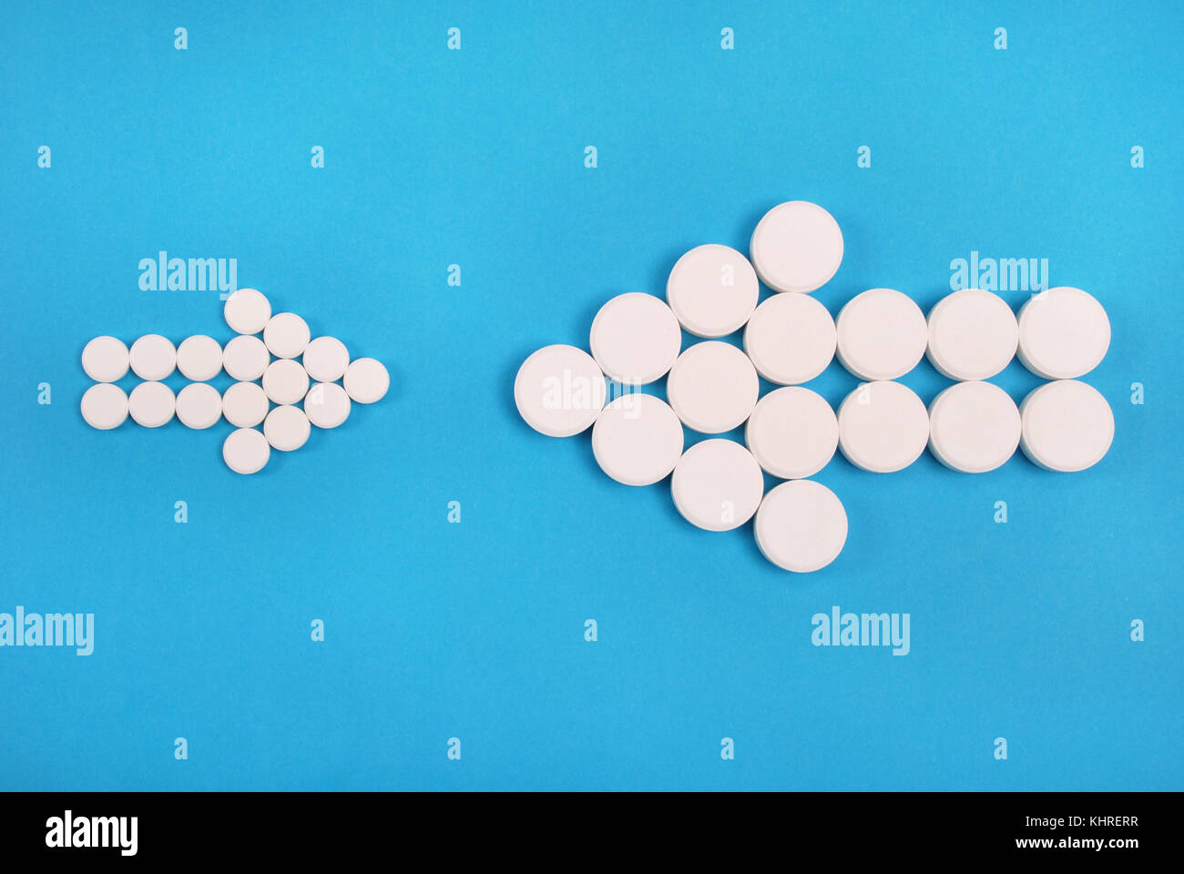 Two arrows collected of tablets are directed against each other. On a ...