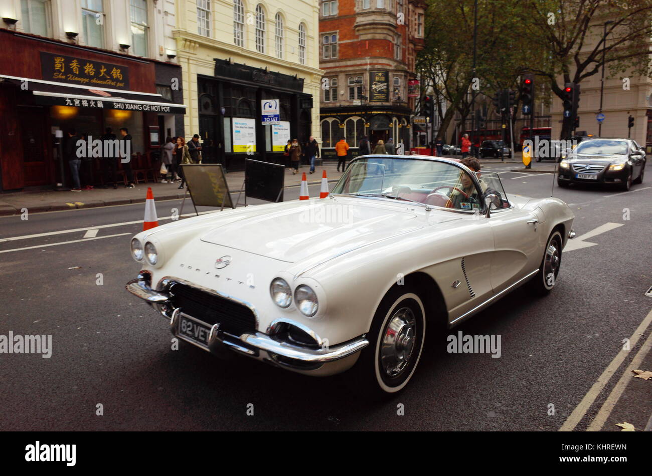 white corvette convertible driven by caucasian man in London, England ...