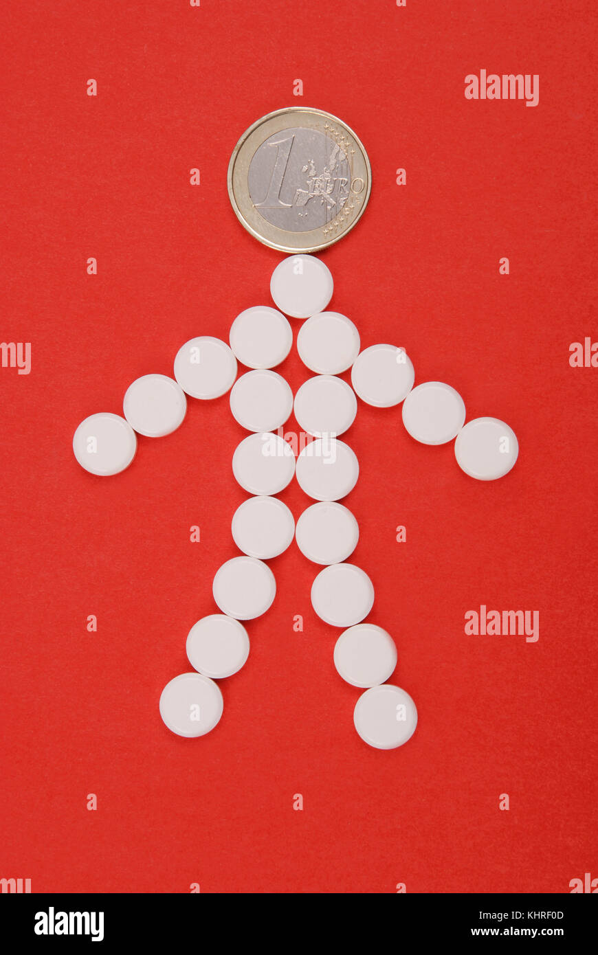 Little man combined from white tablets. Instead of a head a coin one ...