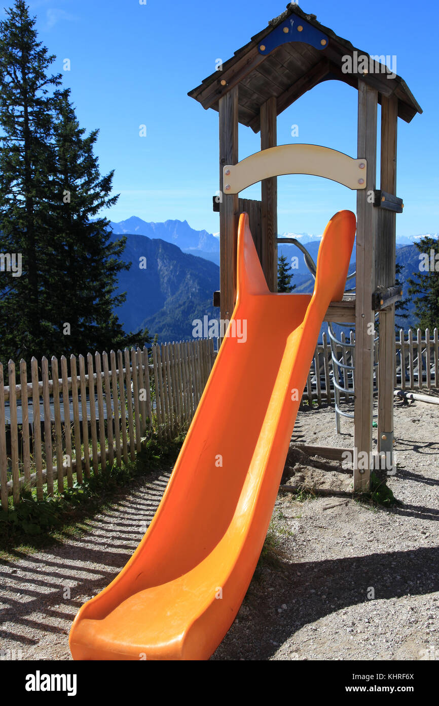 Plastic slide on childrens playground Stock Photo - Alamy