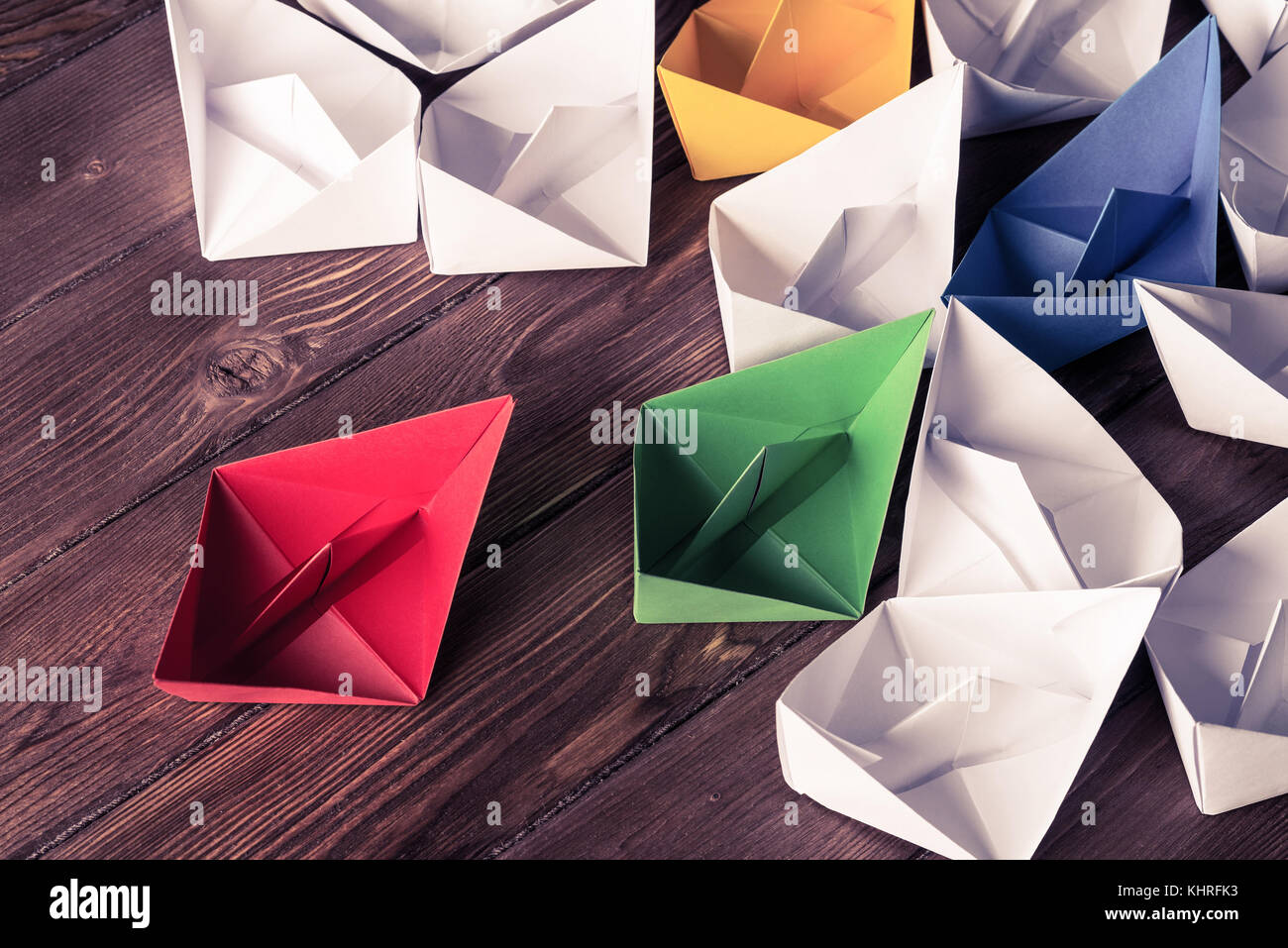 Business leadership concept with white and color paper boats on Stock ...