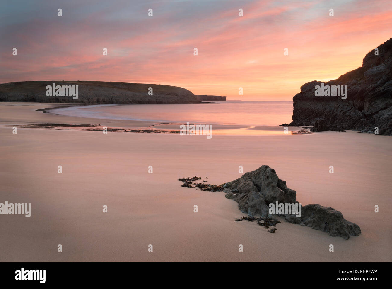 Stunning sunrise landsdcape of idyllic Broadhaven Bay beach on ...