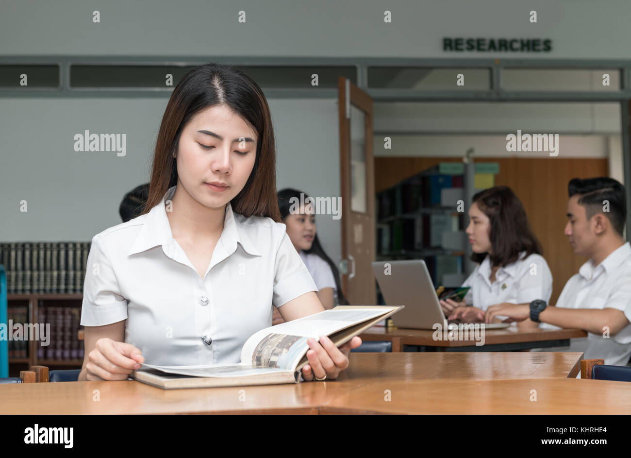 cute asian student reading book in library university, education ...