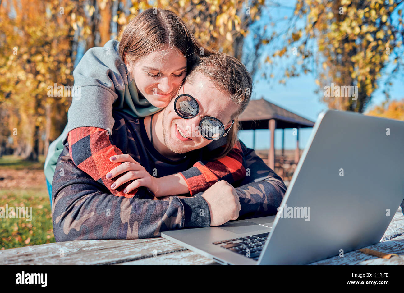 couple in nature with the computer Stock Photo - Alamy