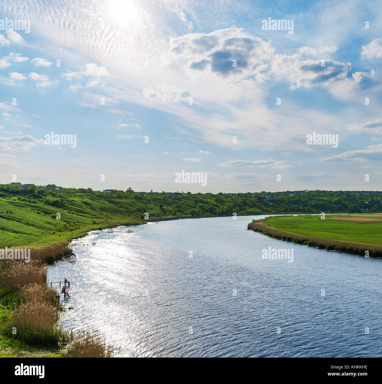 river and low sun in dramatic clouds Stock Photo - Alamy
