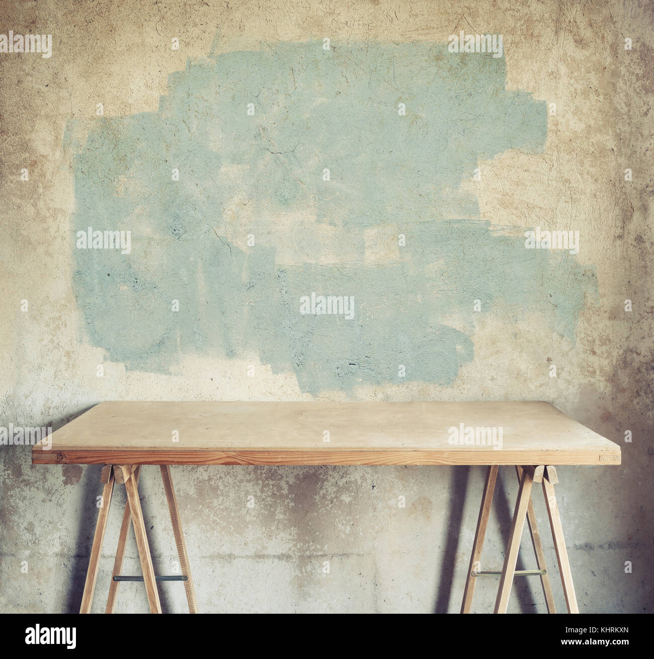Wooden workshop table against concrete wall Stock Photo - Alamy