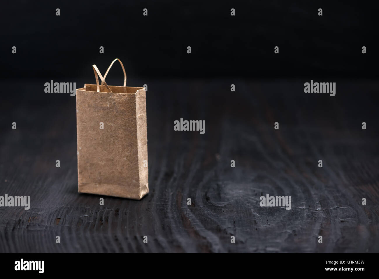 single paper bag on wooden background, concept of China Single day ...