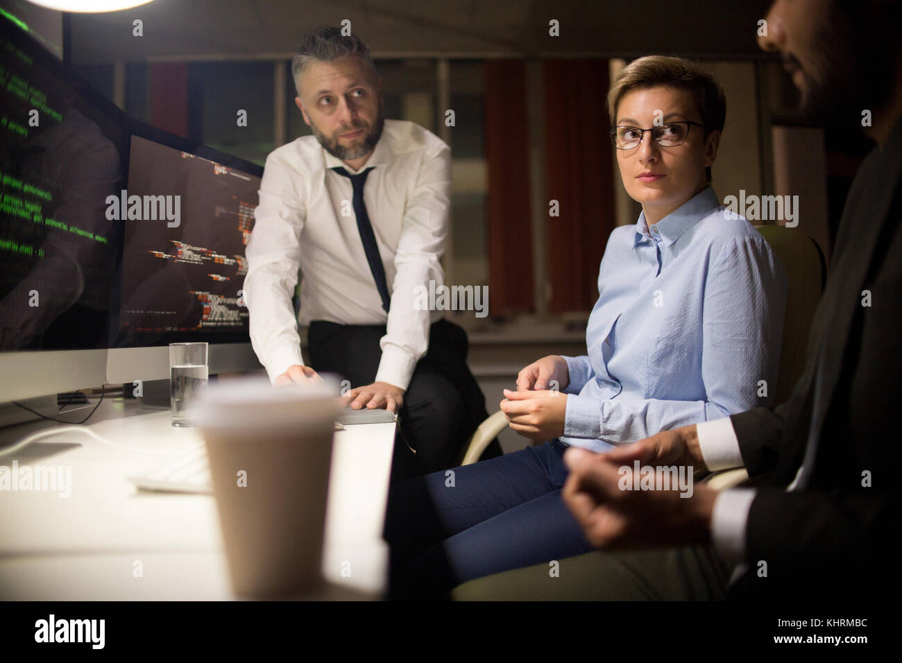 Profile view of bearded software developer sharing ideas concerning ...