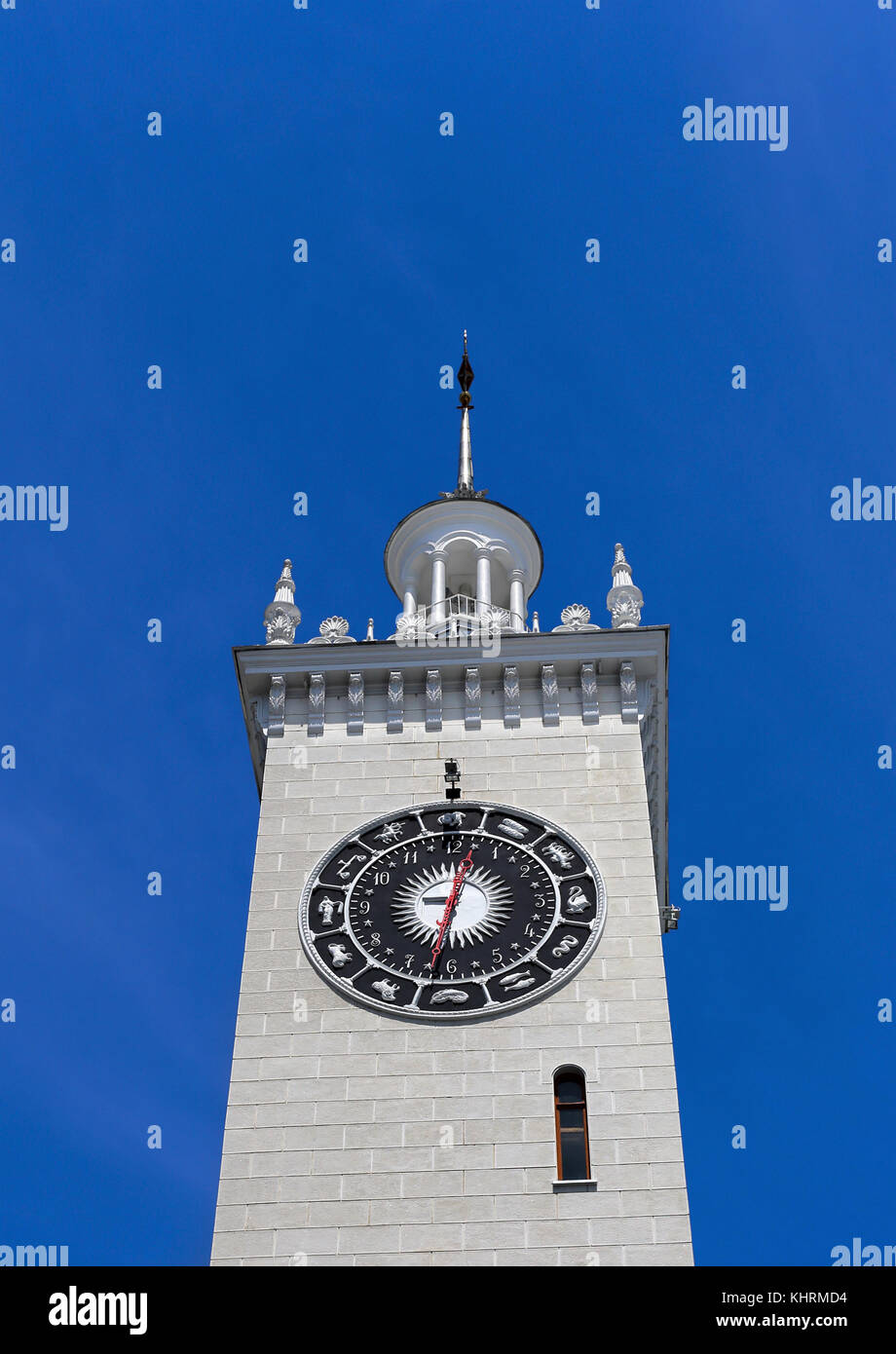 White tower with spire and clock with zodiac signs on the dial Stock ...