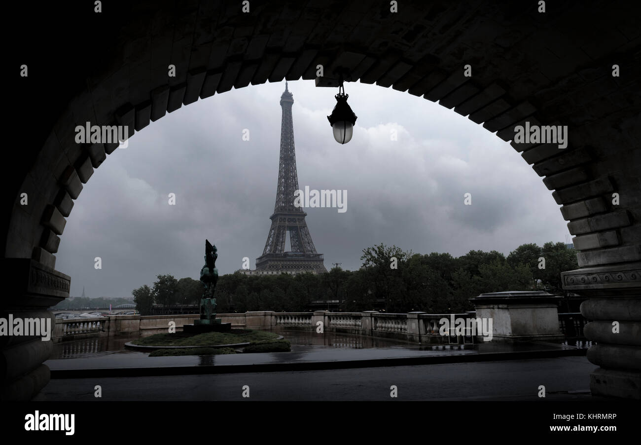 Arch of Eiffel Tower, Paris captured from Bir-Hakeim Bridge crossing ...