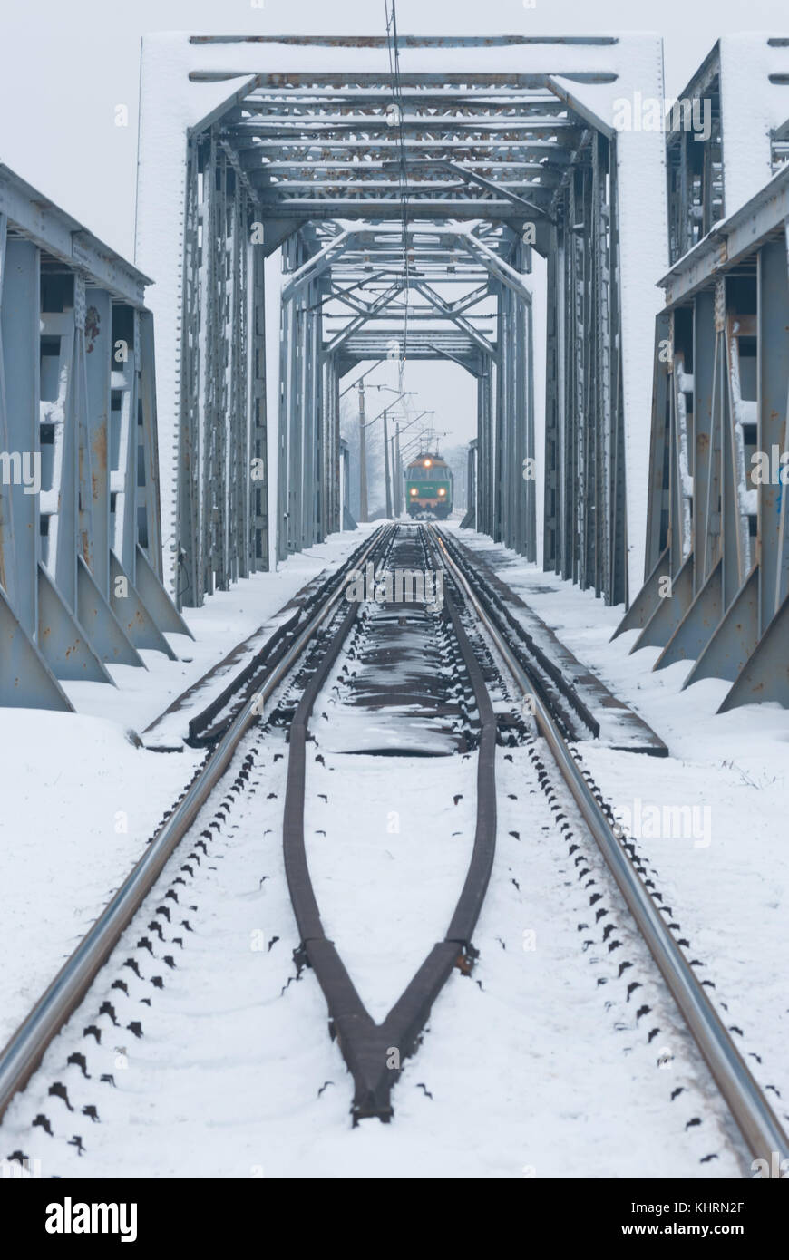 Railway bridge, metal structure covered with snow Stock Photo - Alamy