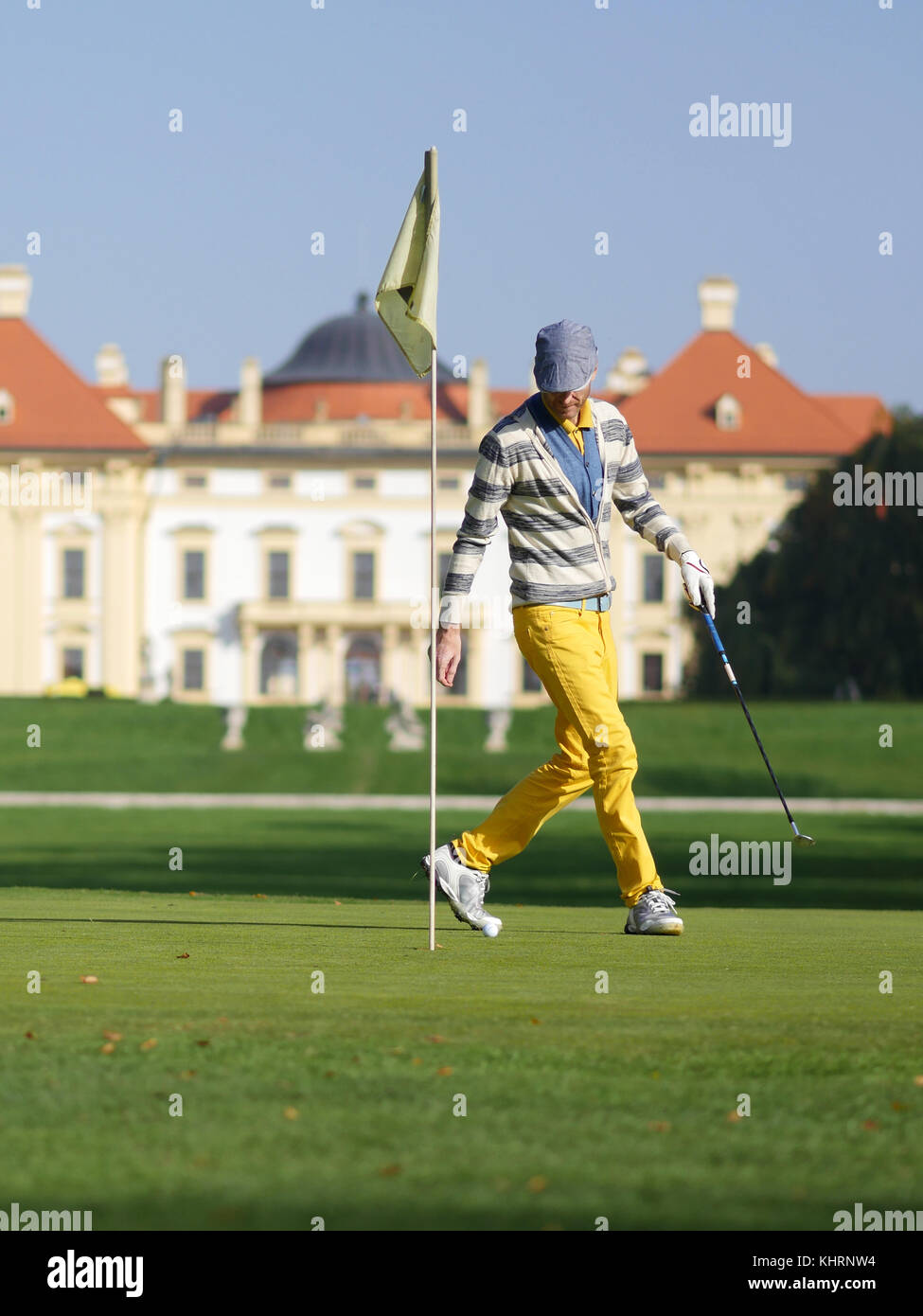 Professional golfer reading a short birdie putt in a tournament Stock ...