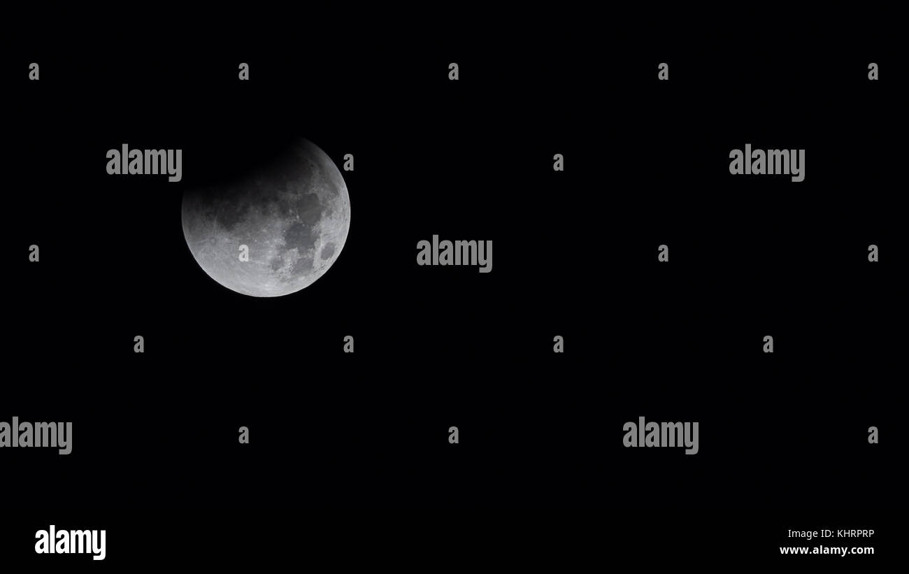 Partial eclipse of the moon Stock Photo - Alamy
