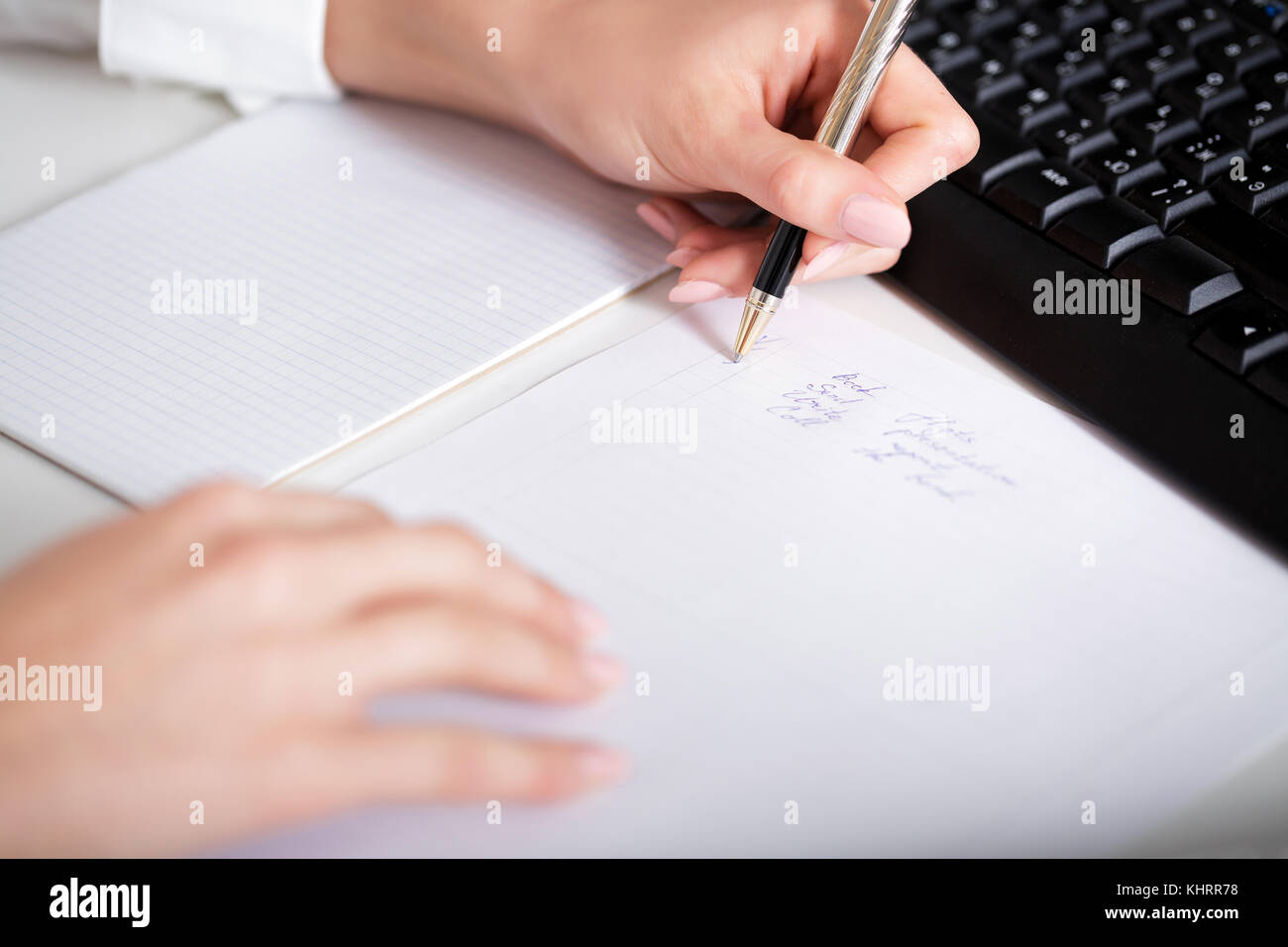business woman hand writing on paper Stock Photo - Alamy