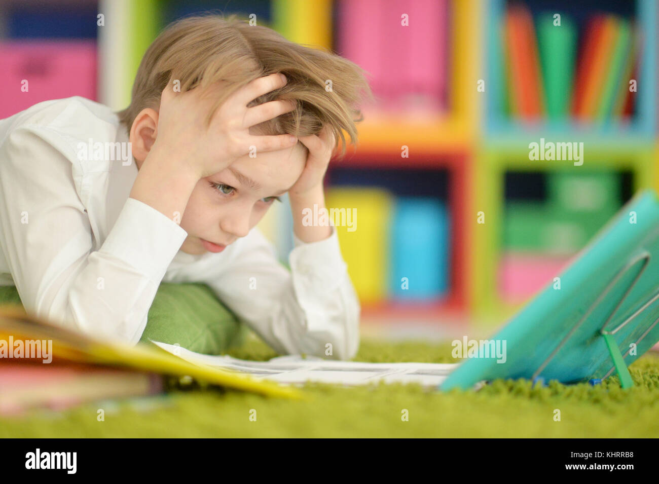 Portrait of a cute boy doing homework Stock Photo - Alamy
