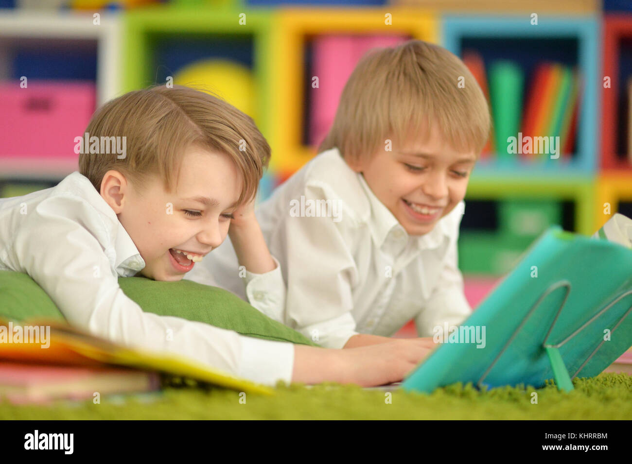 portrait of a cute two boys reading Stock Photo - Alamy