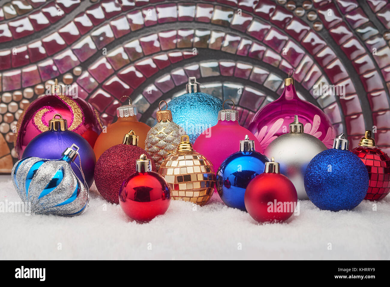 Many beautiful decorative christmas balls on snow Stock Photo - Alamy