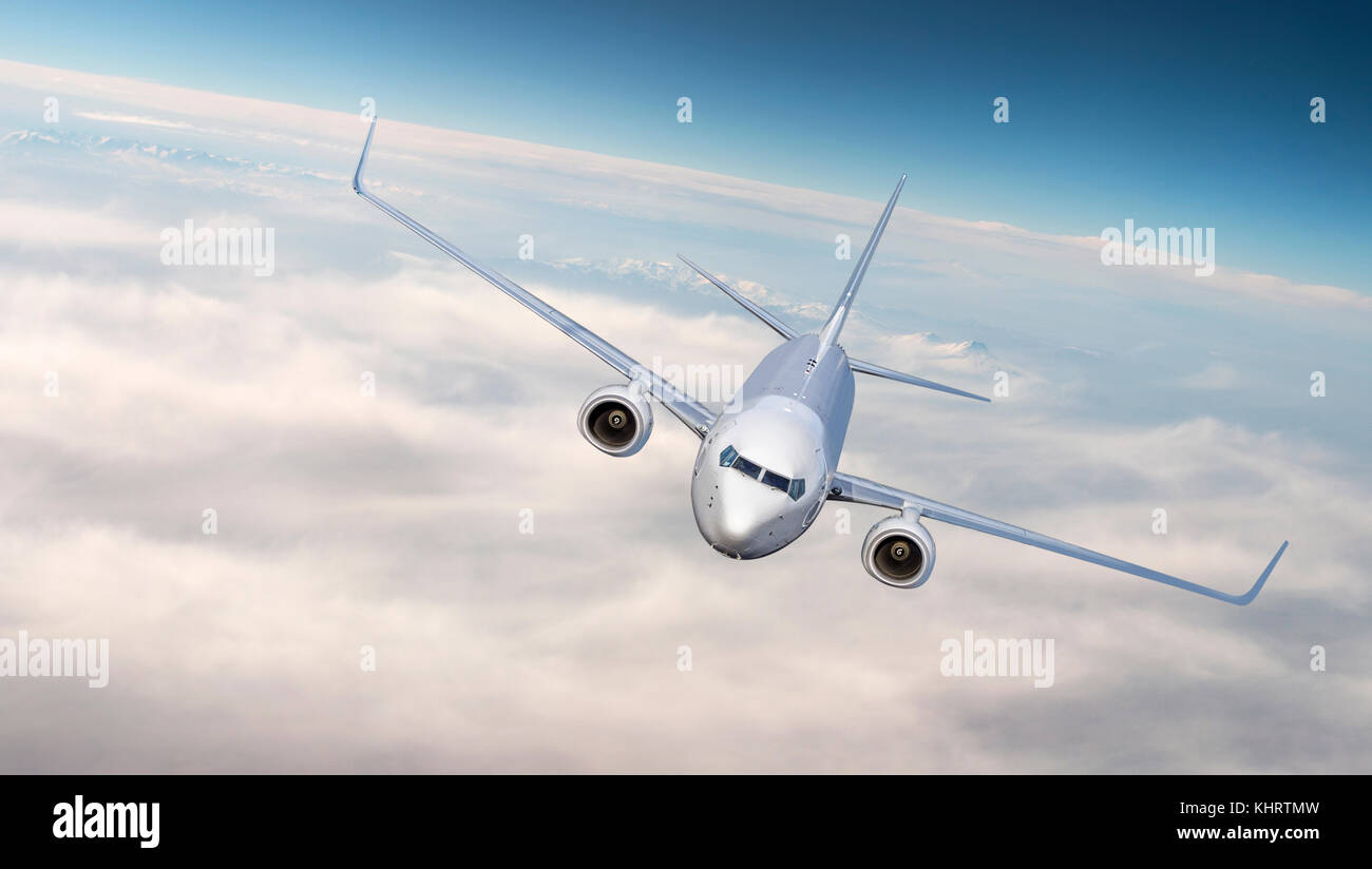 Heavy jumbo jet airplane flying above the clouds Stock Photo - Alamy