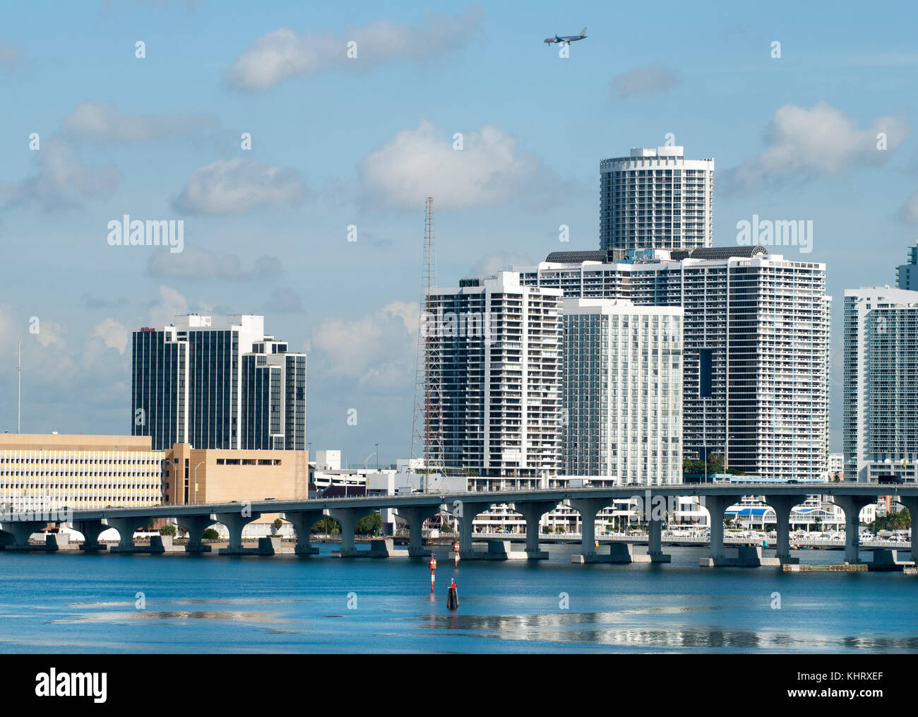 The airplane flying over Miami downtown buildings (Florida Stock Photo ...