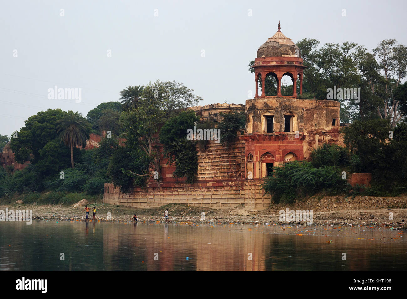 Indian men on the river bank of UYamuna river in front of old tannery ...