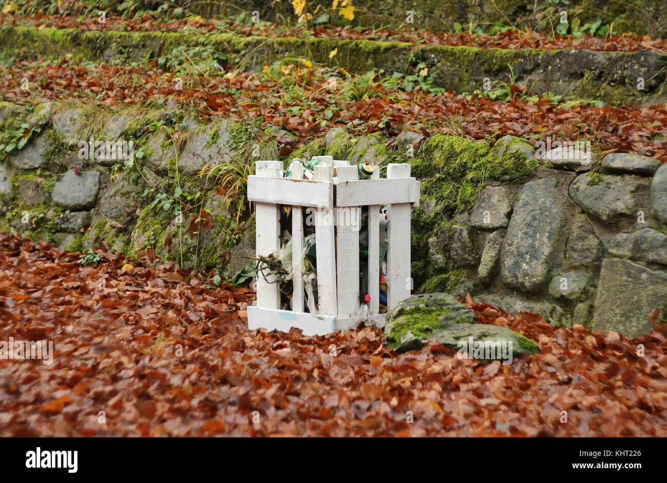 Wooden dustbin in the nature Stock Photo - Alamy