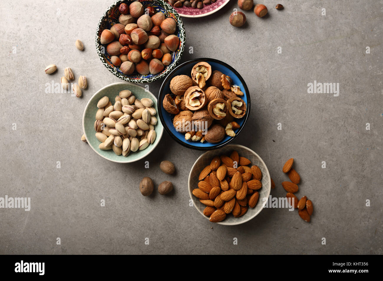 Assorted nuts in bowls, healthy food Stock Photo - Alamy