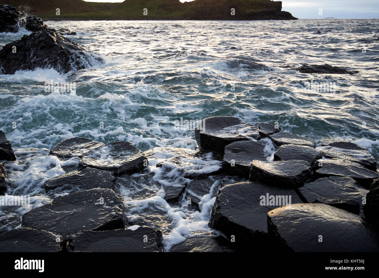 waves breaking over rocks at the Giants Causeway county antrim northern ...