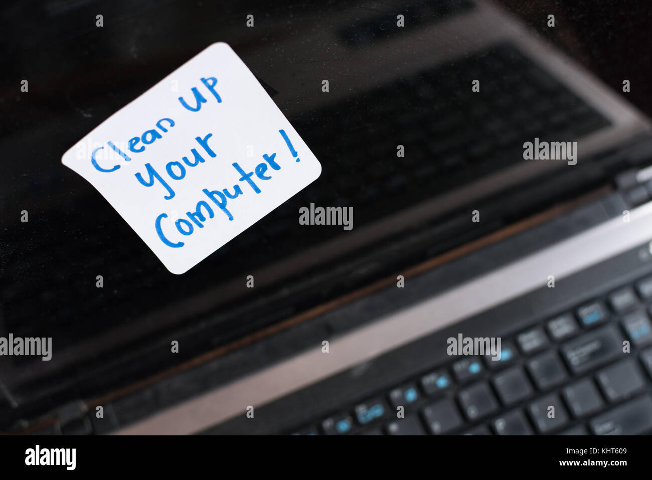 laptop Computer on wooden table with note CLEAN UP YOUR COMPUTER Stock ...
