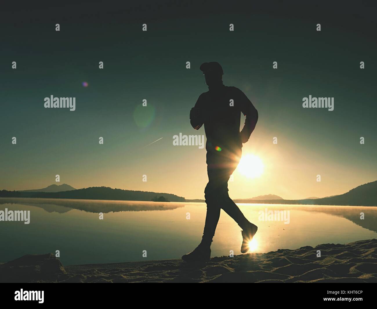 Man running at quiet morning sea. Each day morning workout Stock Photo ...