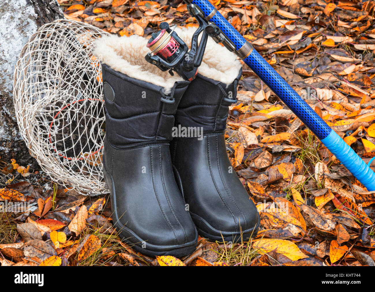 On earth on a background of autumn leaves are the items for fishing ...