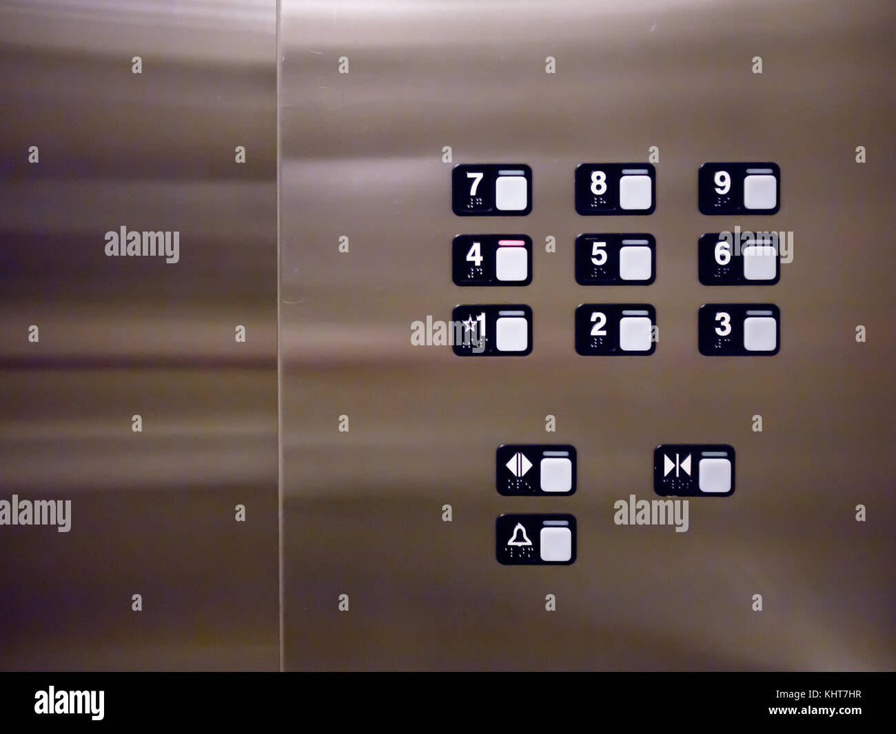 Metal elevator and buttons with fourth floor pressed Stock Photo - Alamy