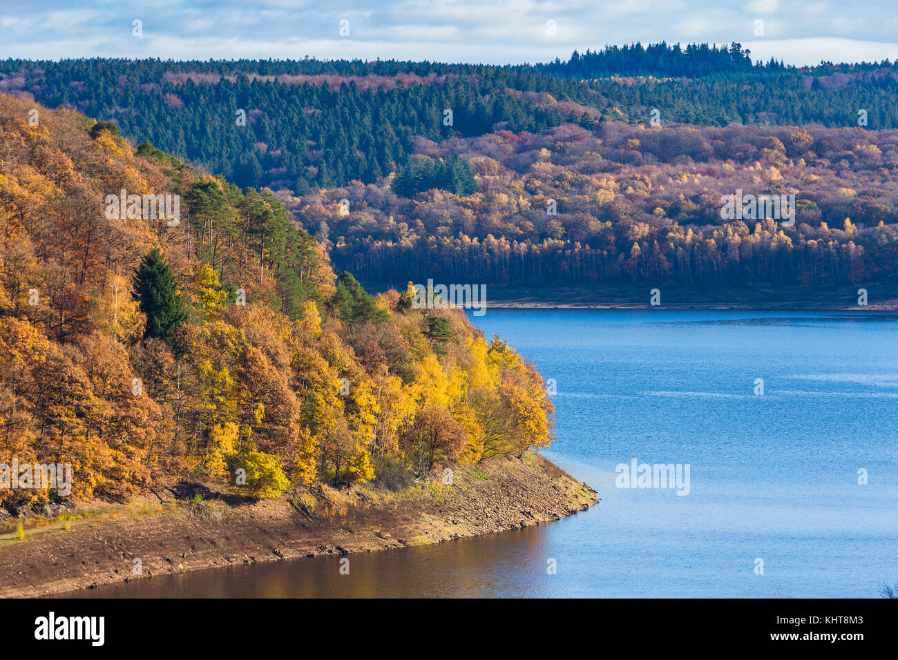 Banks of Gileppe lake with colorful foliage on trees, Belgian Ardennes ...
