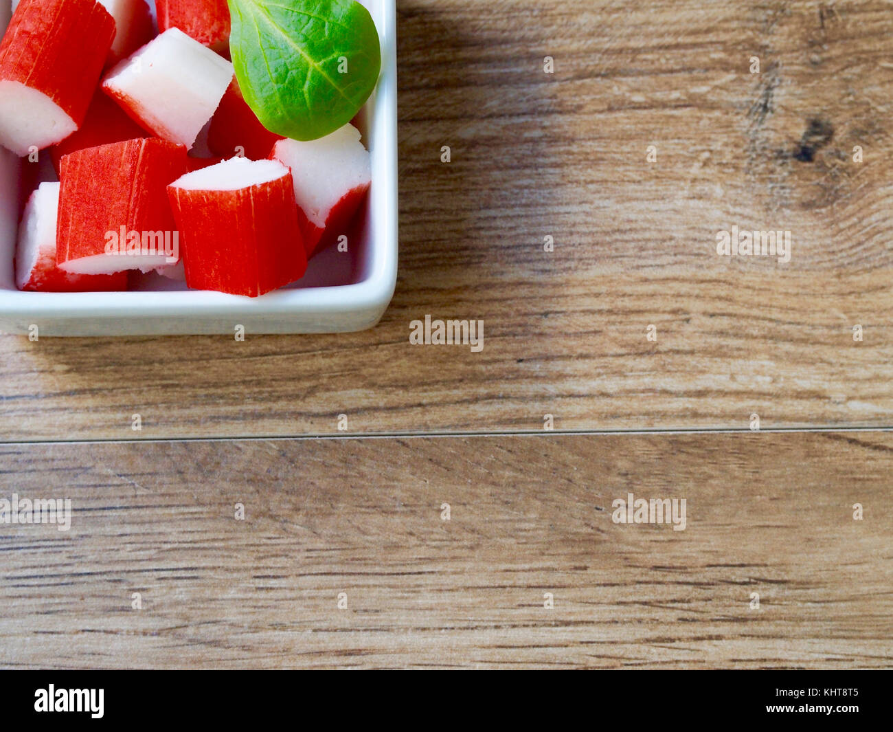 Surimi in a recipe on wood background with space for text Stock Photo ...