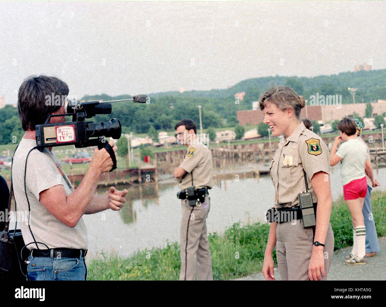 Police officer gives interview to a news cameraman Stock Photo - Alamy