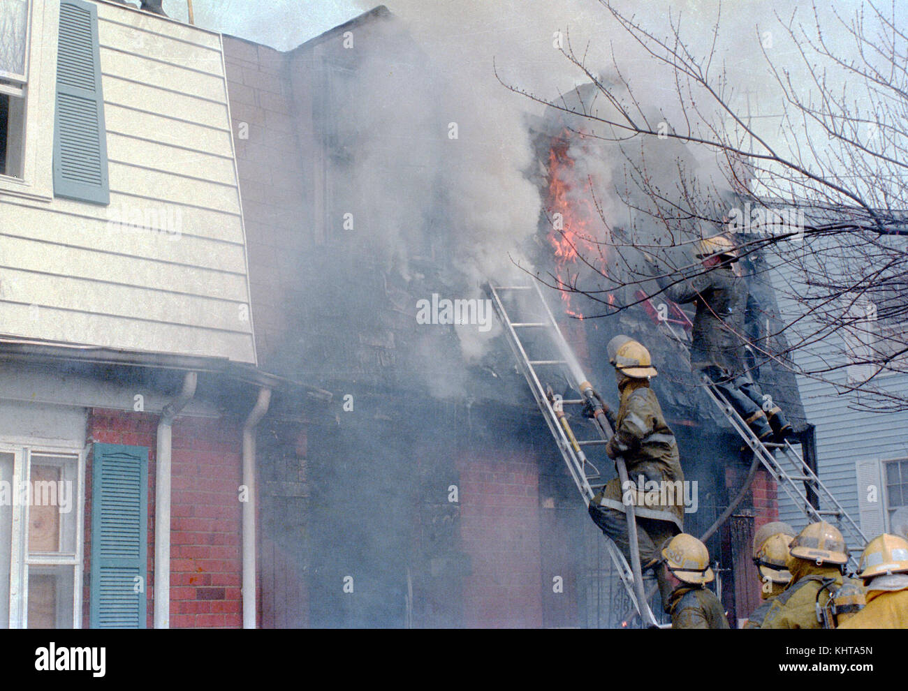 firefighters fighting a fire in a house Stock Photo - Alamy