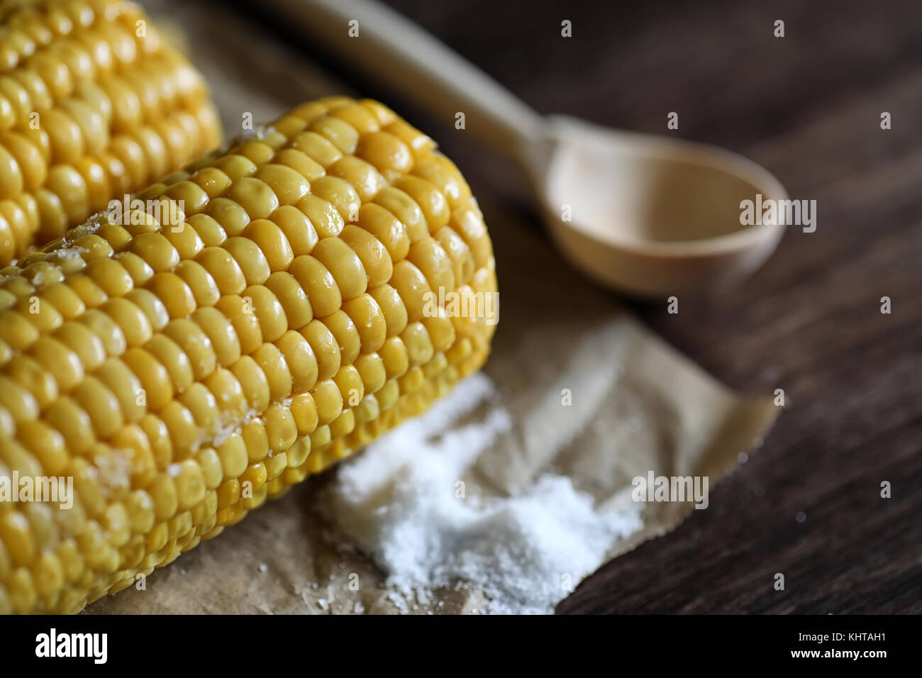 Boiled corn cob with salt on a wood Stock Photo - Alamy