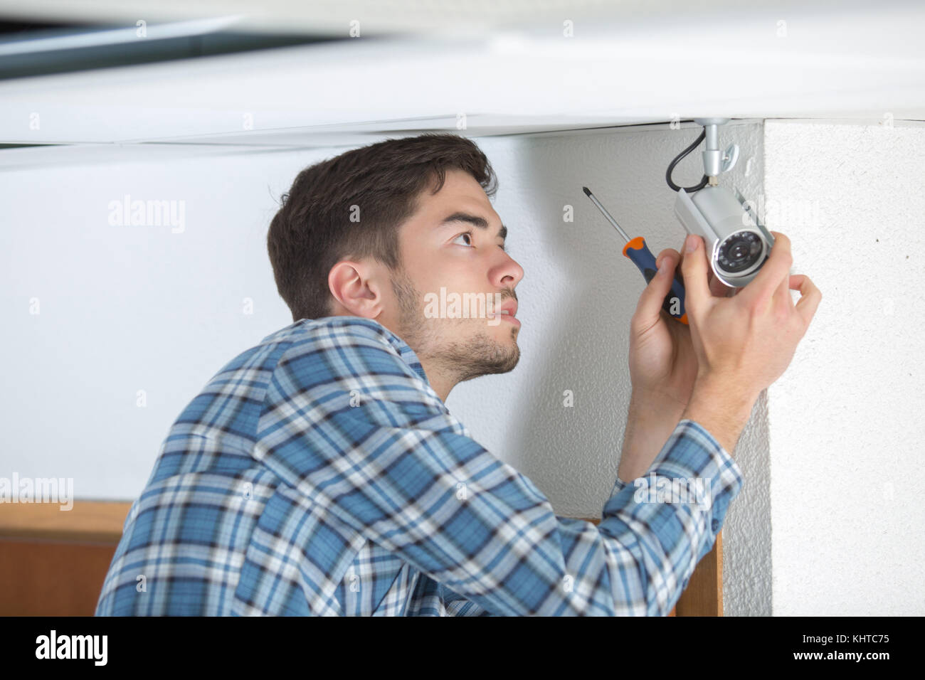 cctv technician installing the device Stock Photo - Alamy