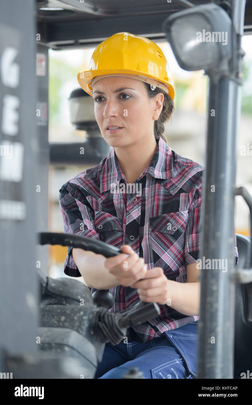 woman working with a forklift in a warehouse Stock Photo - Alamy
