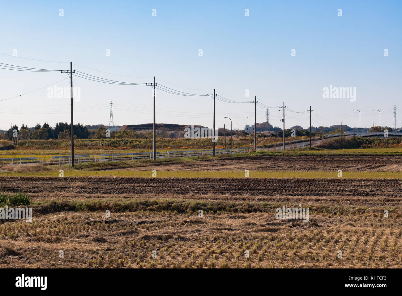 Row of utility poles and farm in the japanese countryside Stock Photo ...