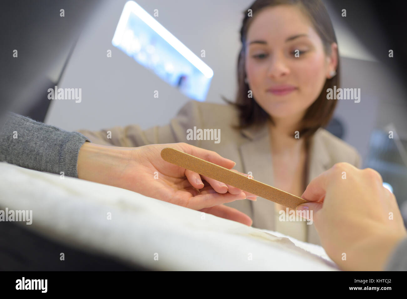worker in a nail salon nail specialist Stock Photo - Alamy