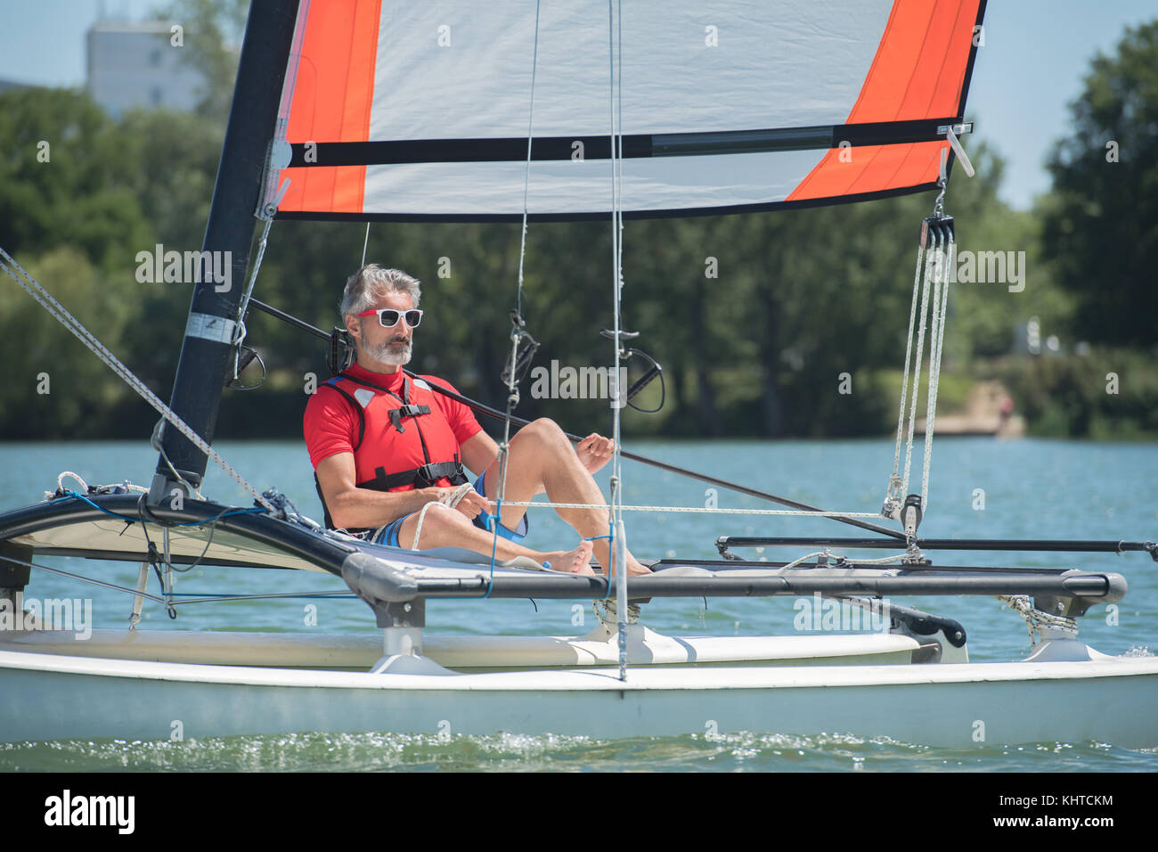 sailing man on sailboat during regatta Stock Photo - Alamy