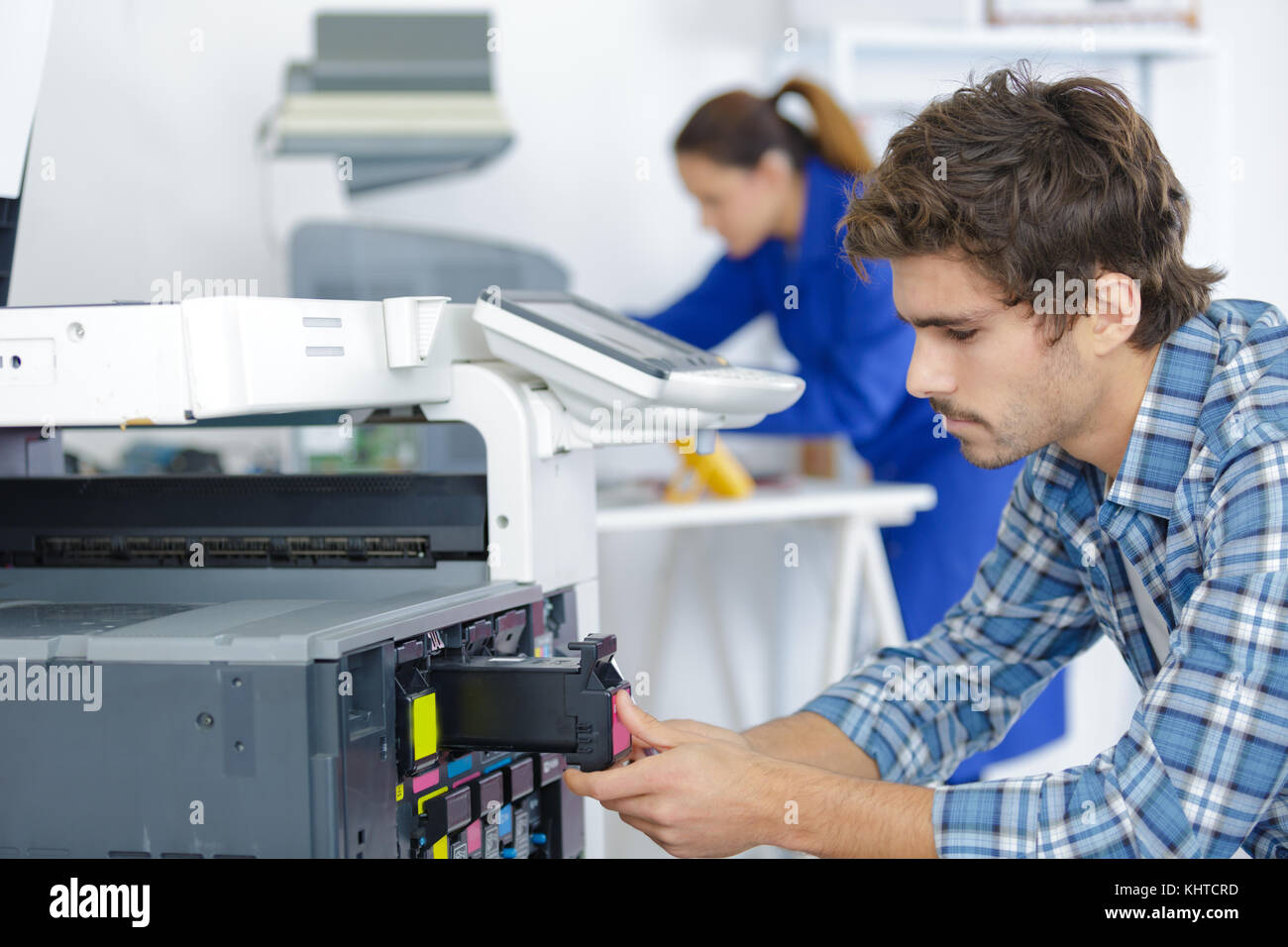 printer repairing by a young technician Stock Photo - Alamy