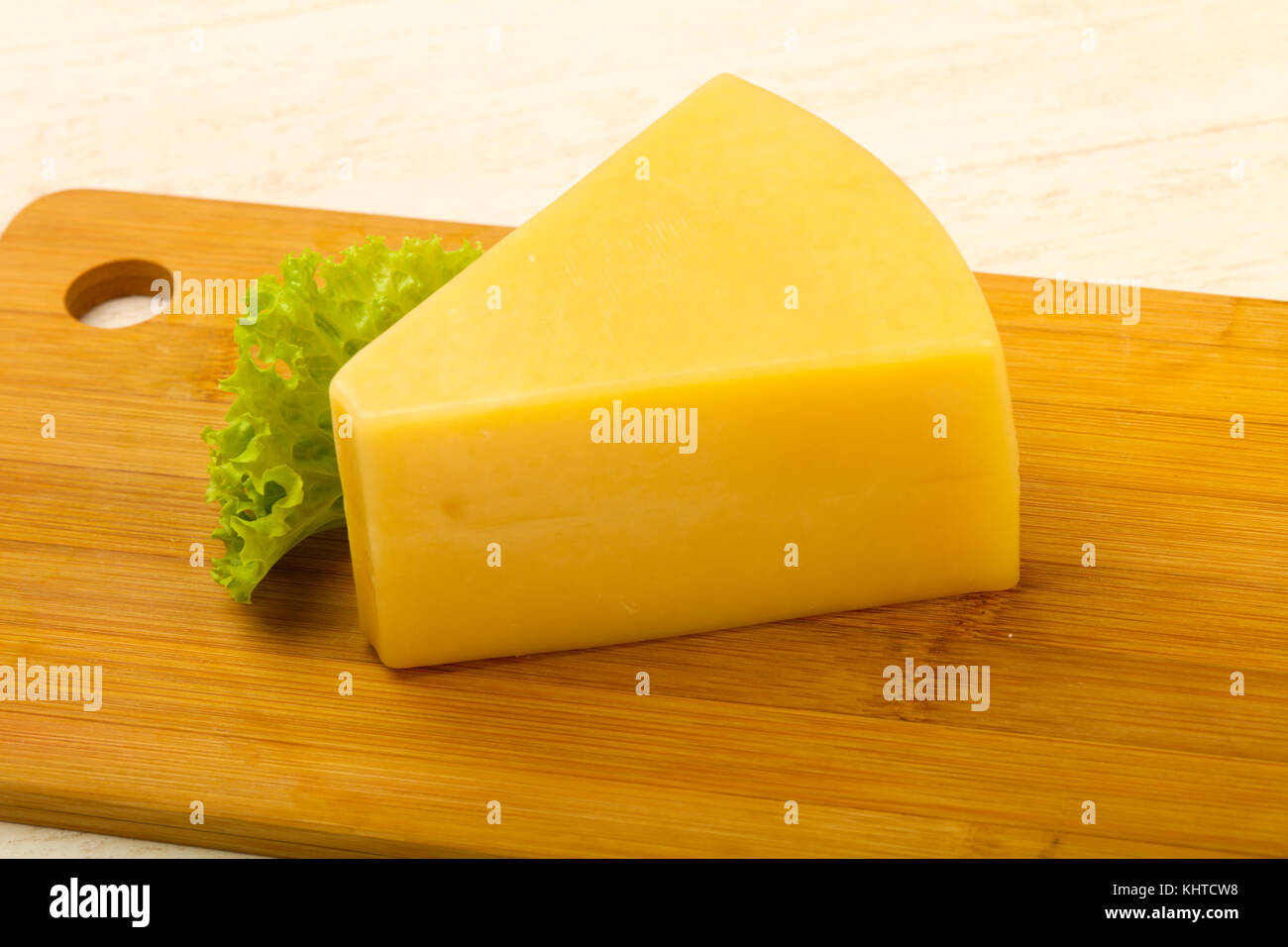 Parmesan cheese triangle Stock Photo - Alamy