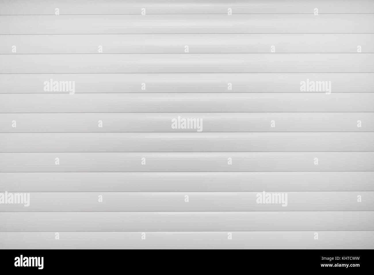 Aluminum white industrial roller shutters background Stock Photo - Alamy