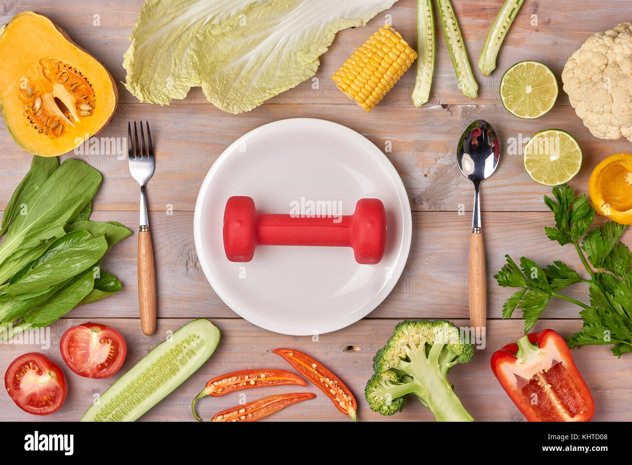 Food and sheet of paper with a diet plan on a dark wooden table ...