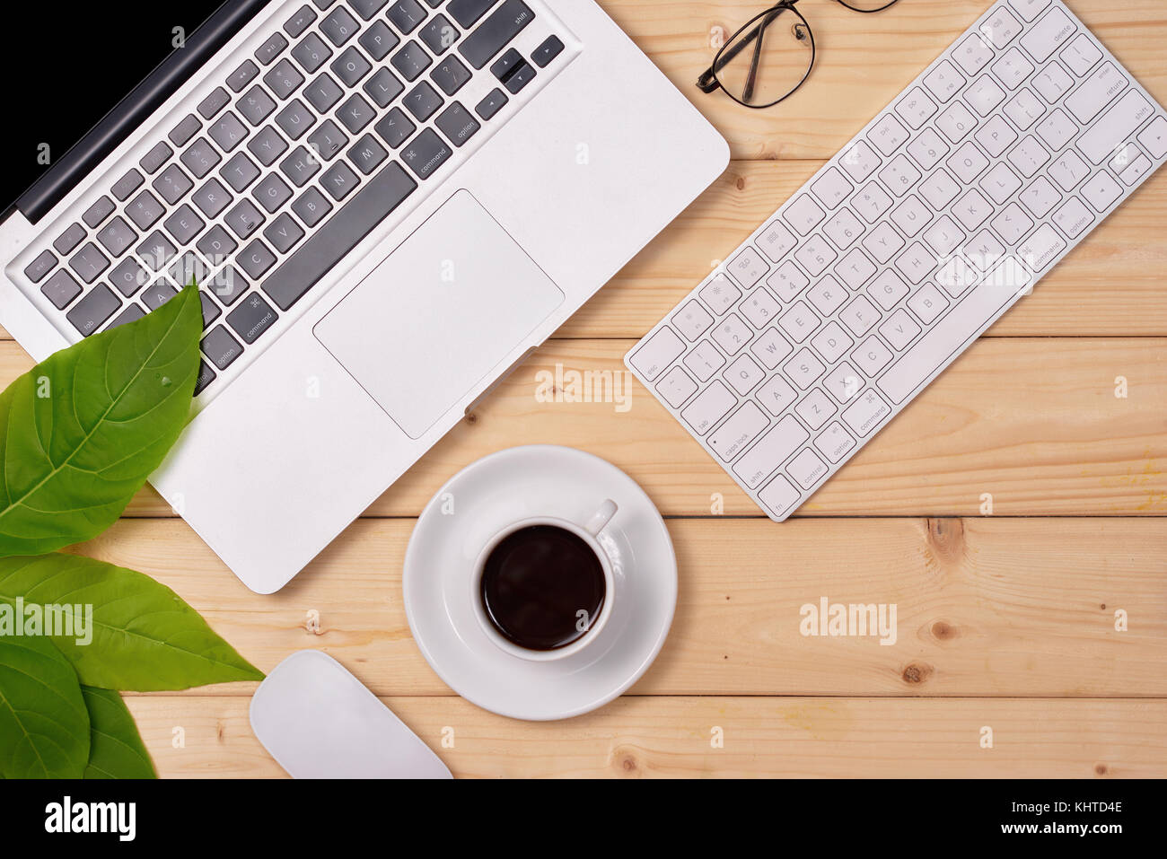 Office desk table with laptop computer and coffee. Top view with copy ...