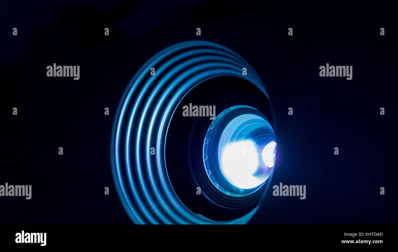 Photograph of a lighted projector lens Stock Photo - Alamy